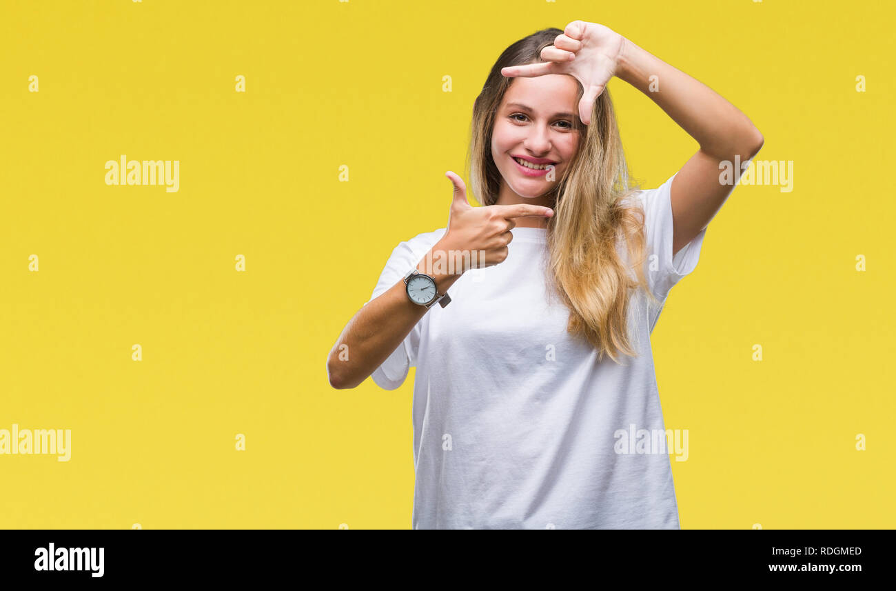Young Beautiful Blonde Woman Wearing Casual White T Shirt Over Isolated Background Smiling