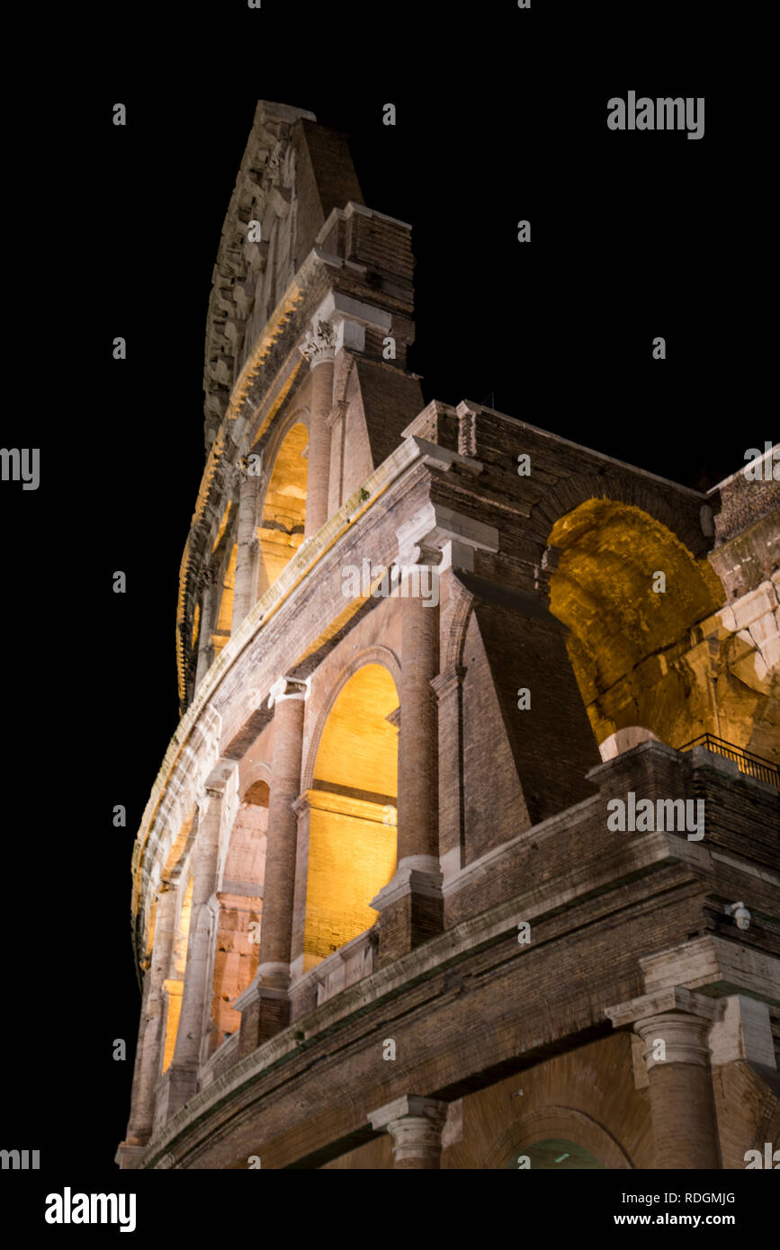 Glimpse of the Colosseum at night, in Rome illuminated by artificial ...