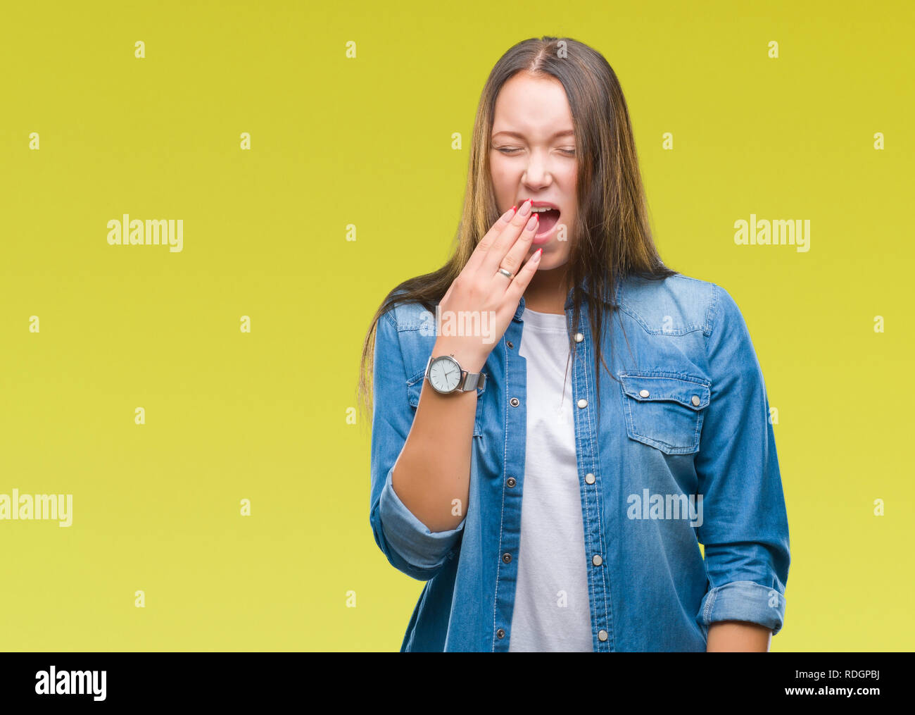 Young caucasian beautiful woman over isolated background bored yawning ...