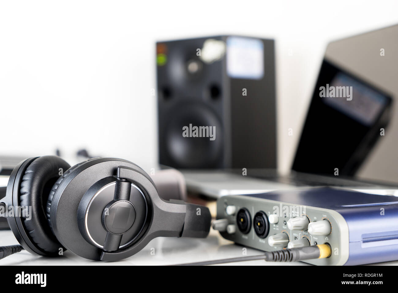 Music Studio headphone lying on working desktop Stock Photo - Alamy