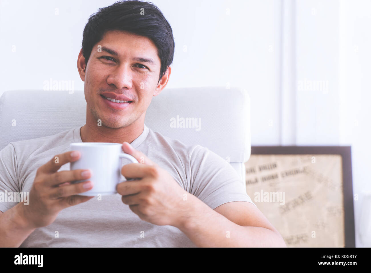 Asian man drinking coffee hi-res stock photography and images - Alamy