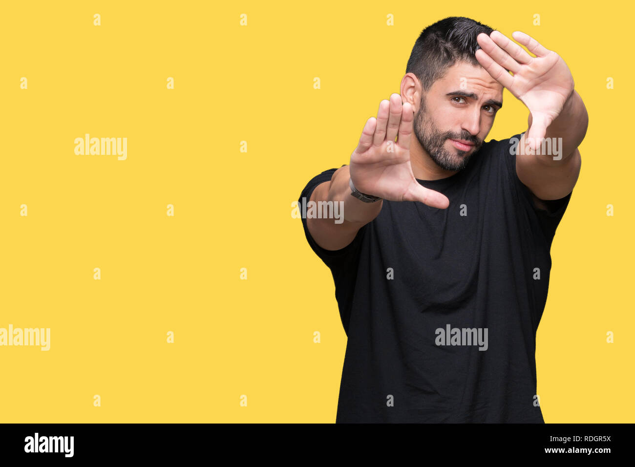 Young handsome man over isolated background Smiling doing frame using ...