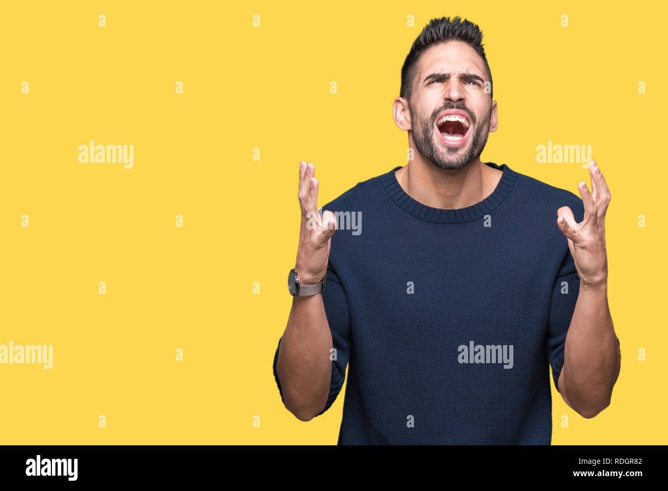 Young handsome man wearing sweater over isolated background crazy and ...