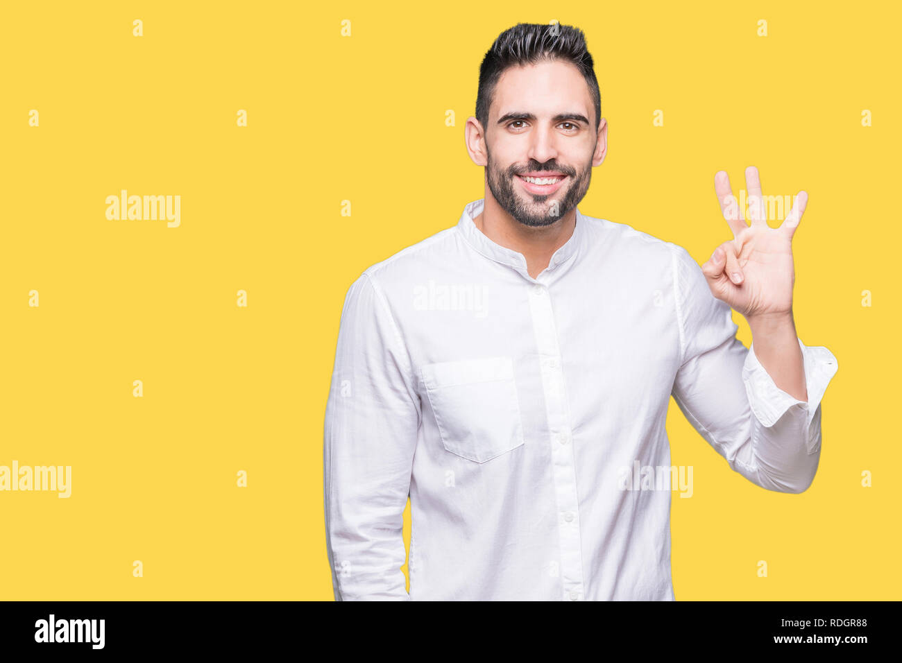 Young business man over isolated background showing and pointing up ...