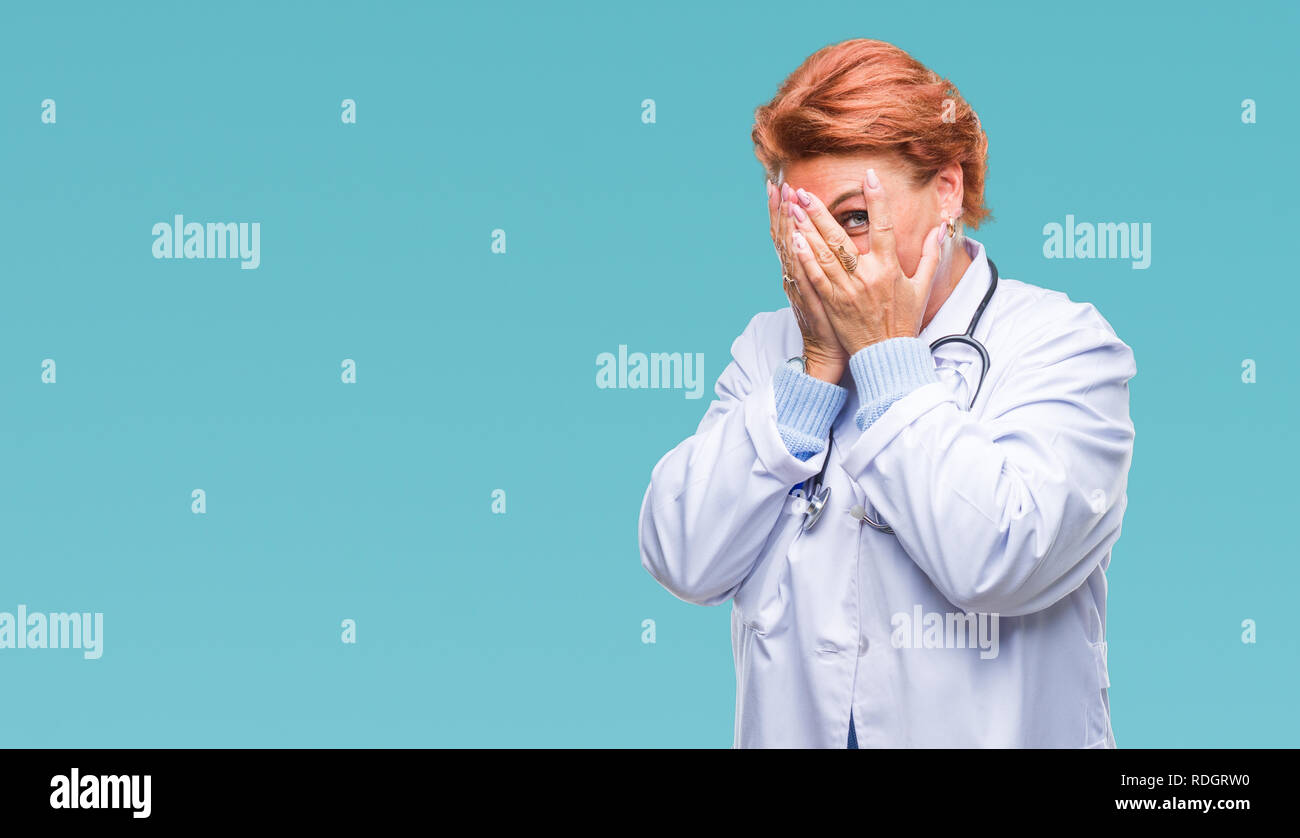 Senior caucasian doctor woman wearing medical uniform over isolated ...