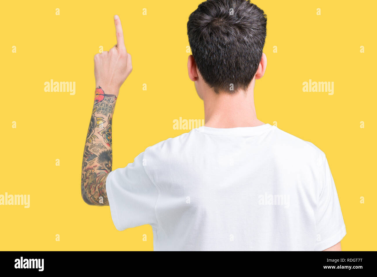 Young handsome man wearing white t-shirt over isolated background ...
