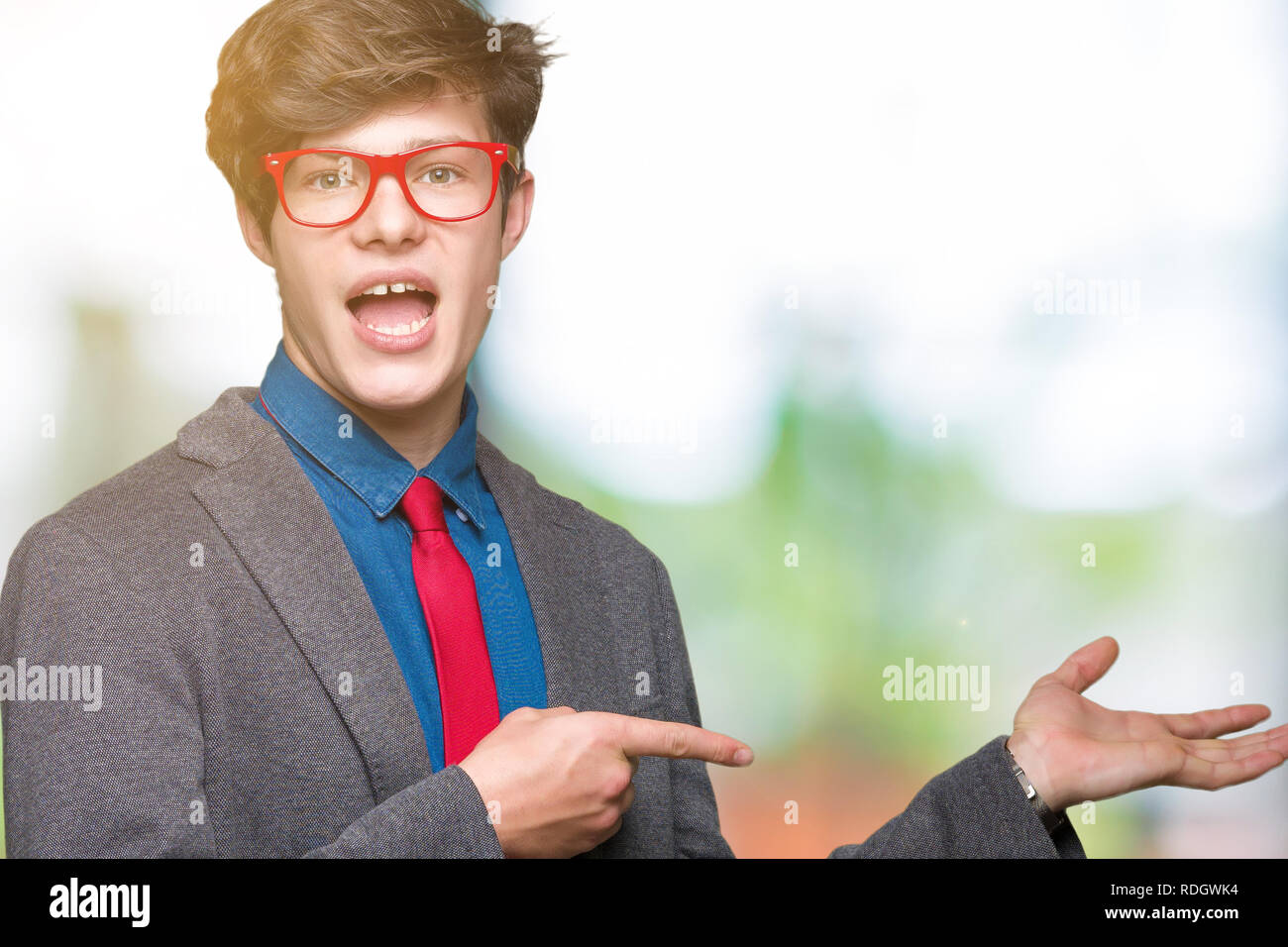 Young handsome business man wearing red glasses over isolated ...