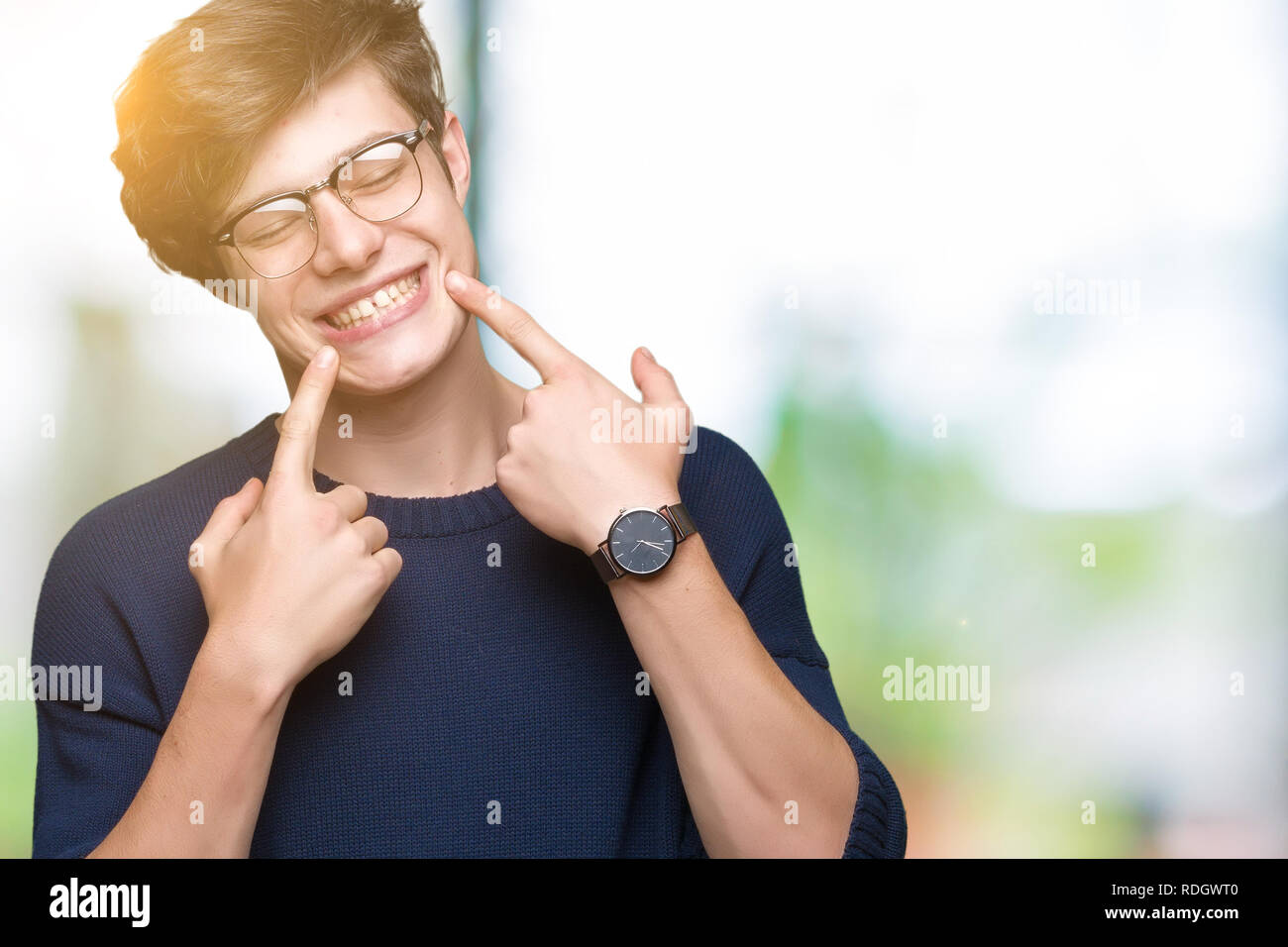 Young handsome man wearing glasses over isolated background smiling ...