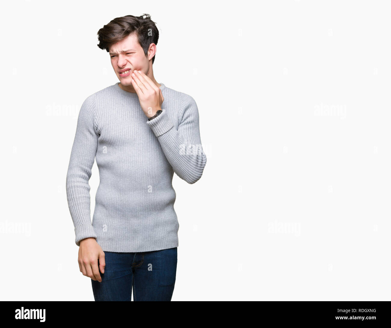 Young handsome man wearing winter sweater over isolated background ...