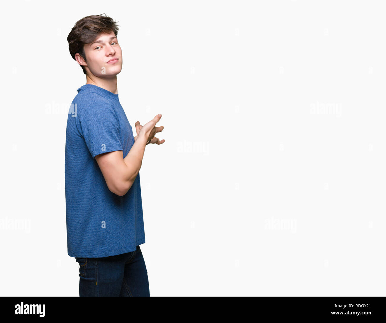 Young handsome man wearing blue t-shirt over isolated background ...