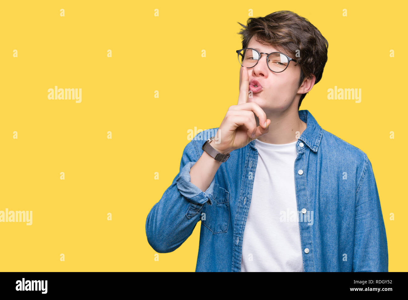 Teenager boy gesture shh hi-res stock photography and images - Alamy
