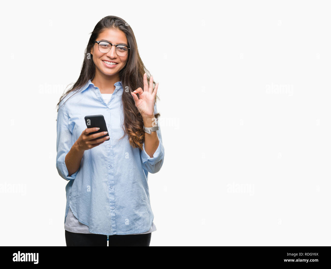 Young beautiful arab woman texting using smartphone over isolated ...