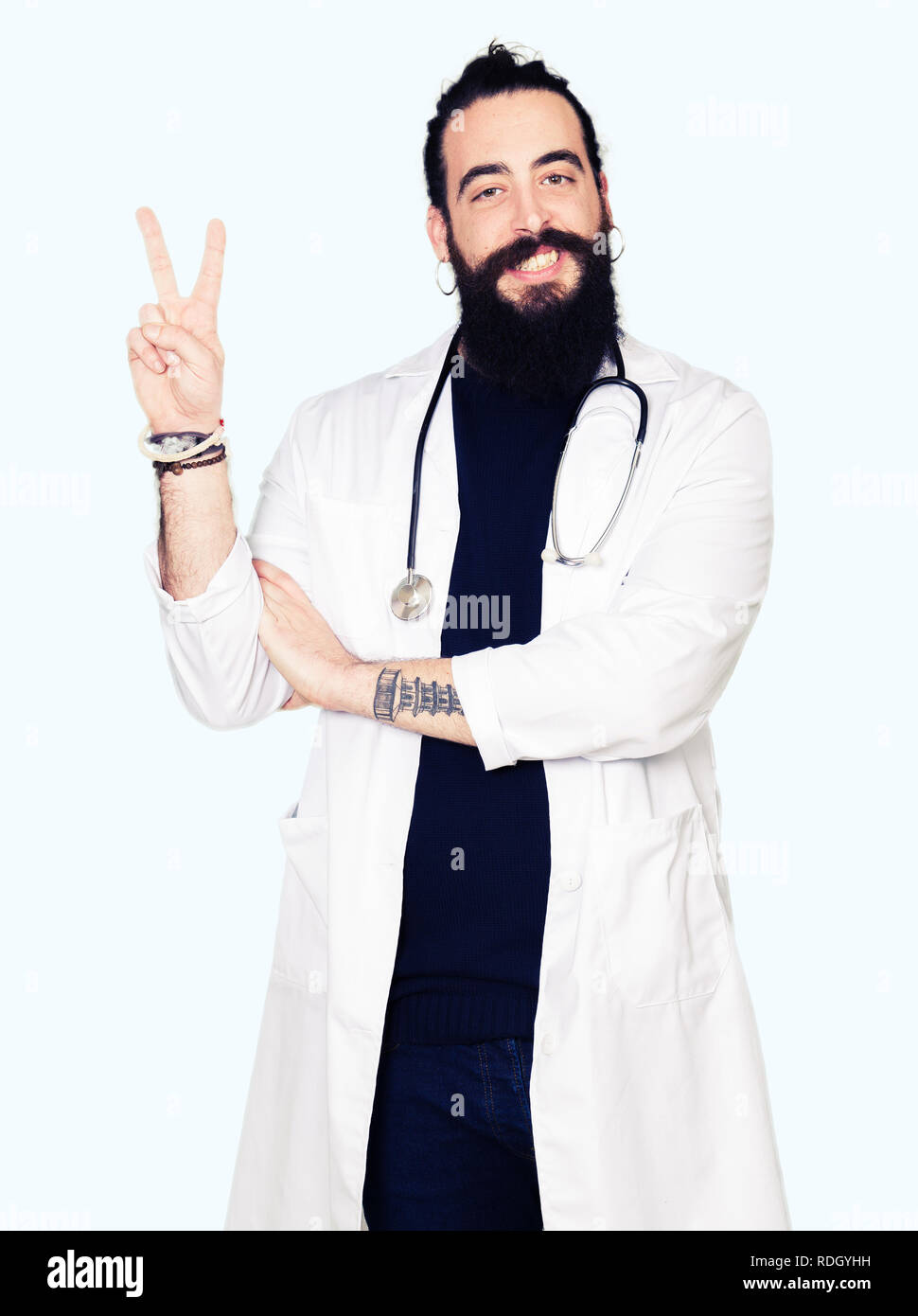 Doctor with long hair wearing medical coat and stethoscope smiling with ...