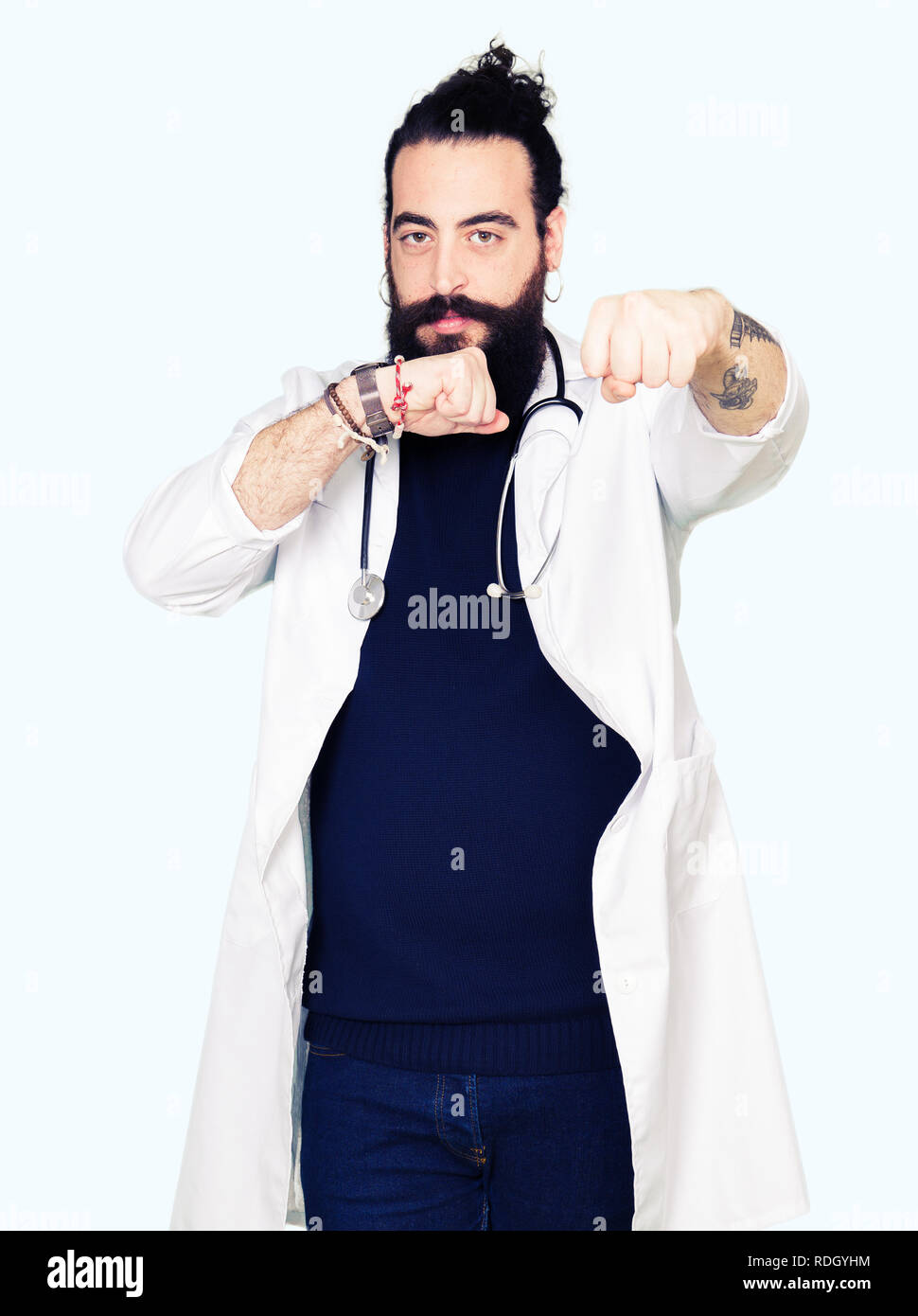 Doctor with long hair wearing medical coat and stethoscope Punching ...