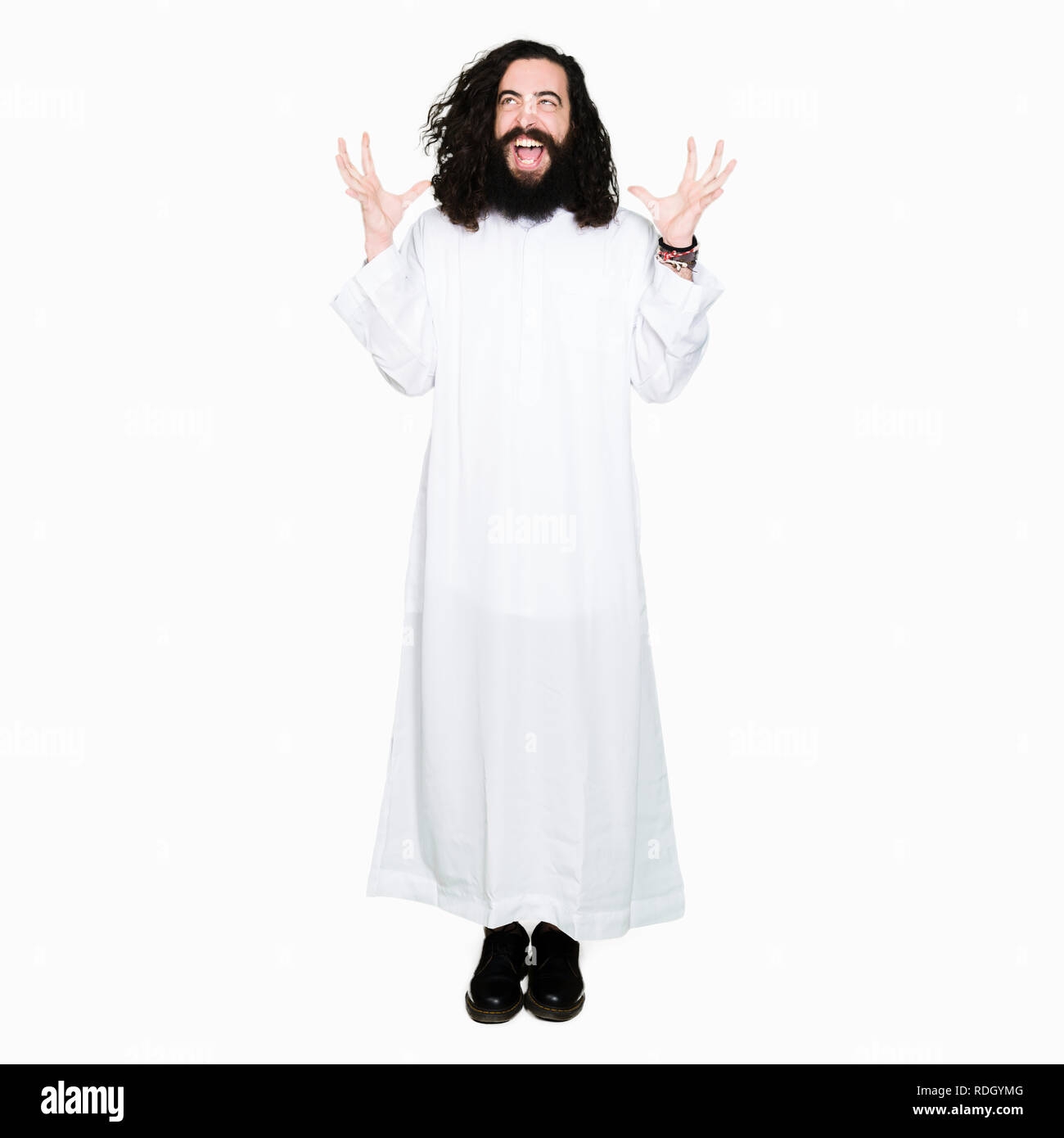 Man wearing Jesus Christ costume celebrating mad and crazy for success ...