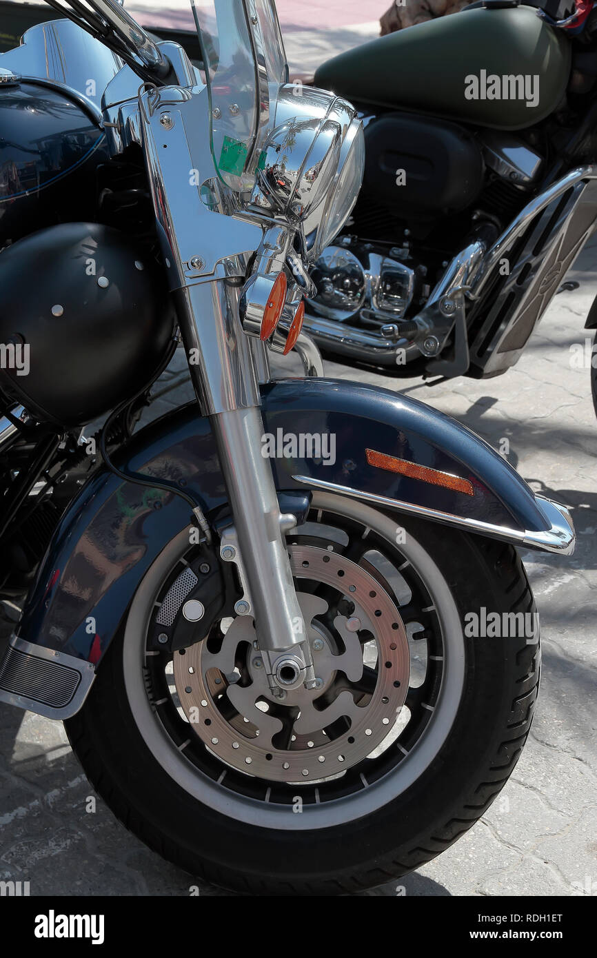 side view in foreground of the front of a blue motorcycle Stock Photo ...