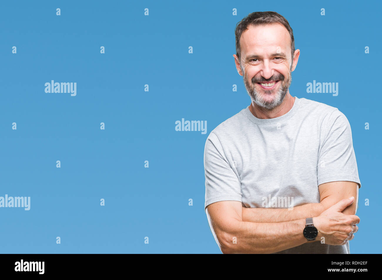 Middle age senior hoary man over isolated background happy face smiling ...