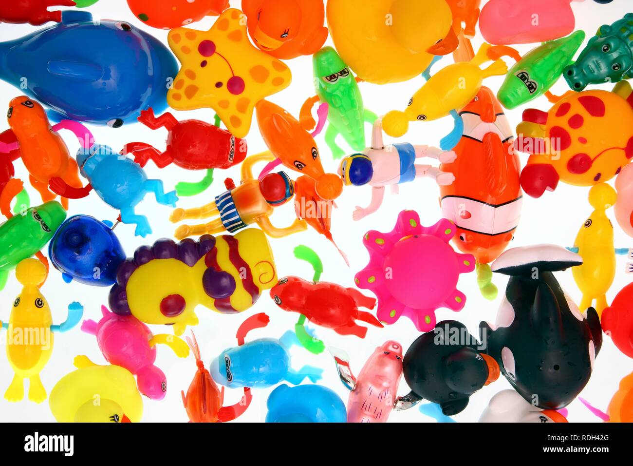 Various colourful water toys Stock Photo - Alamy