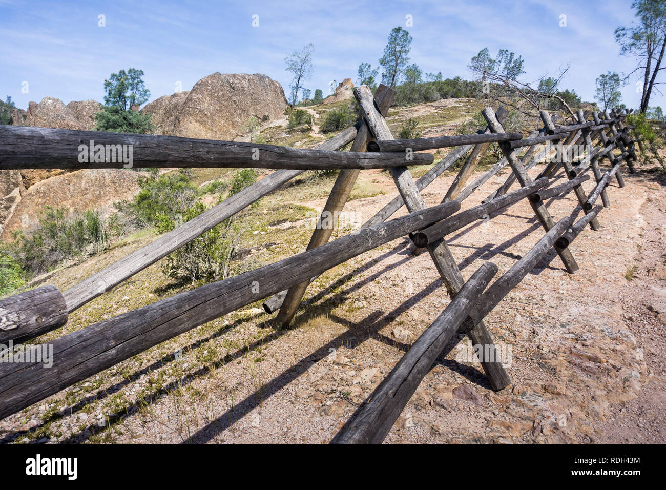 Wooden barrier on the side of a hiking trail, Pinnacles National Park ...
