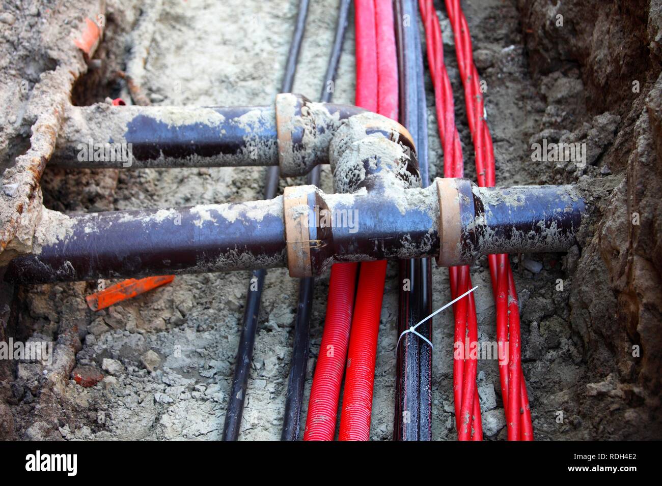 Installation of various cables in a building site, power lines and ...