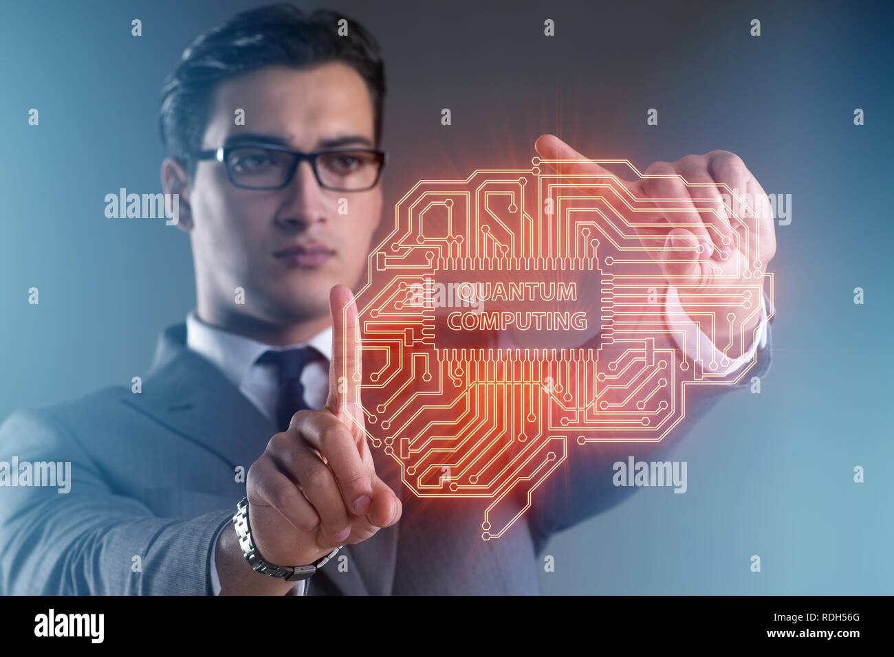 Businessman pressing virtual button in quantum computing concept Stock Photo - Alamy