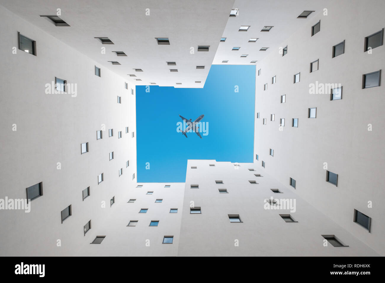 looking up inside apartment building courtyard - building facade, court ...