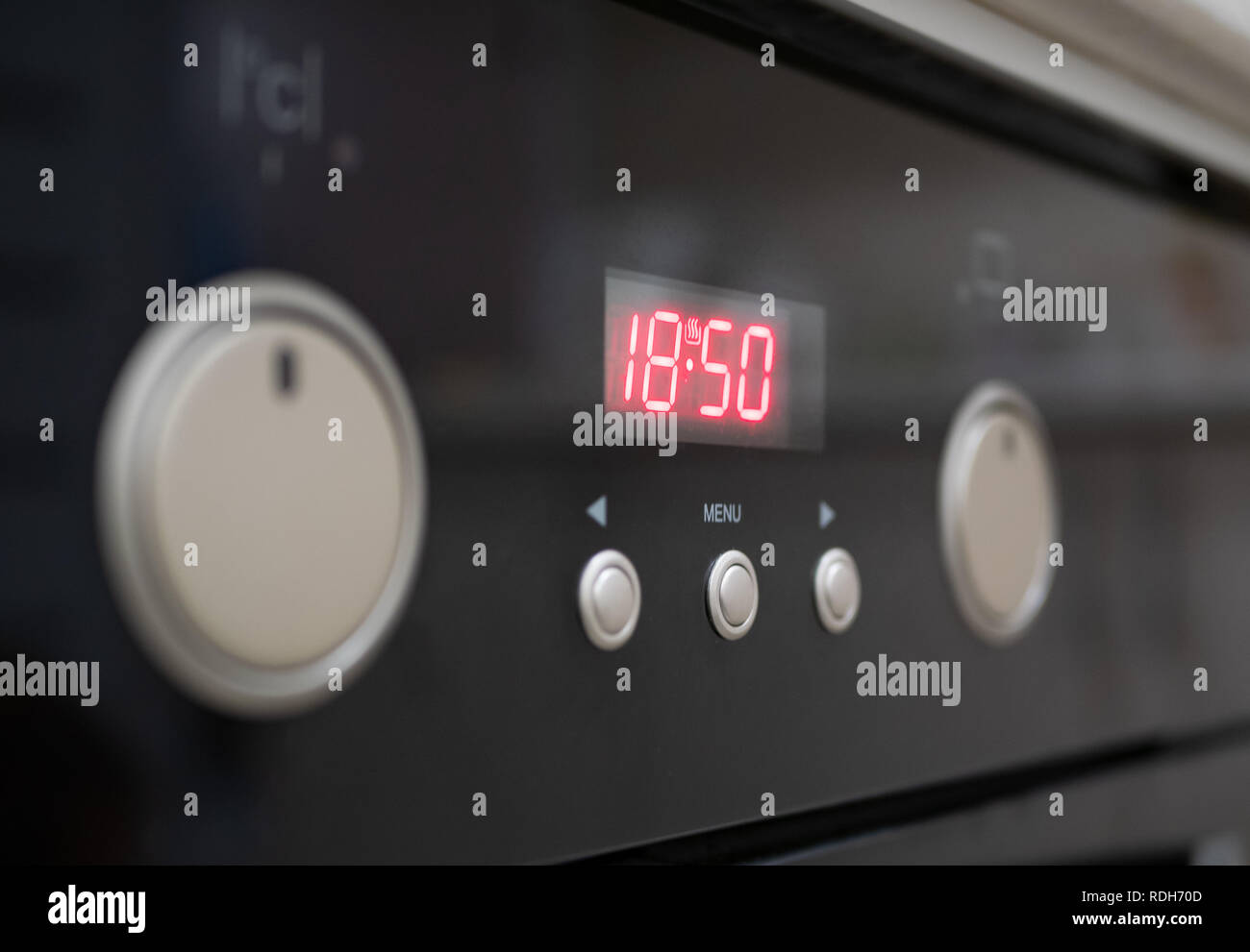 closeup of control buttons and time display of modern kitchen ...