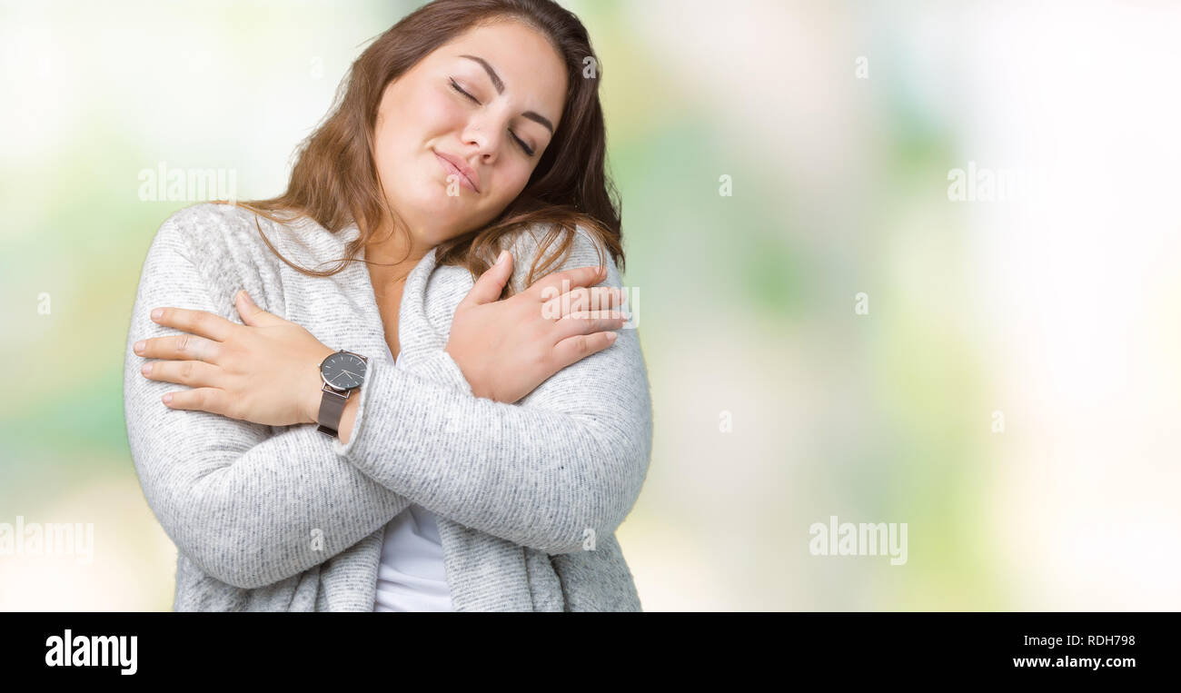 Beautiful plus size young woman wearing winter jacket over isolated ...