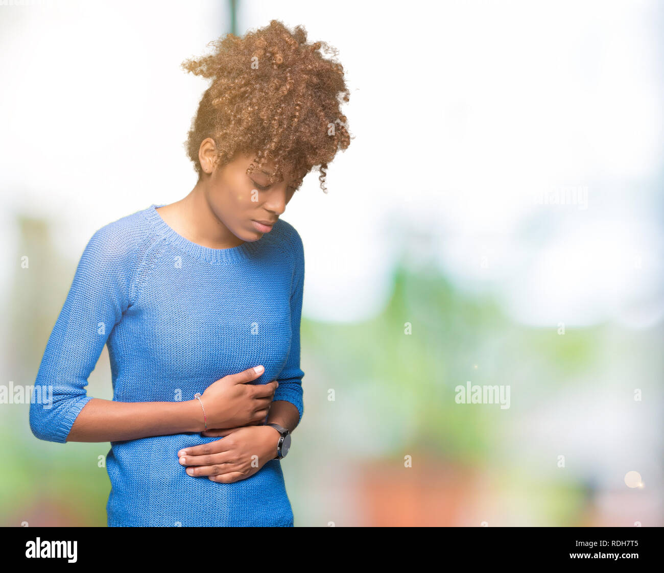 Beautiful young african american woman over isolated background with ...