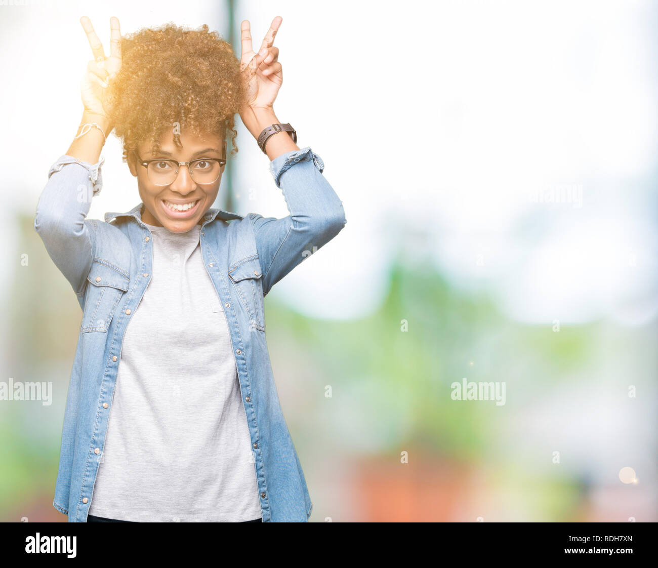 Beautiful young african american woman wearing glasses over isolated ...