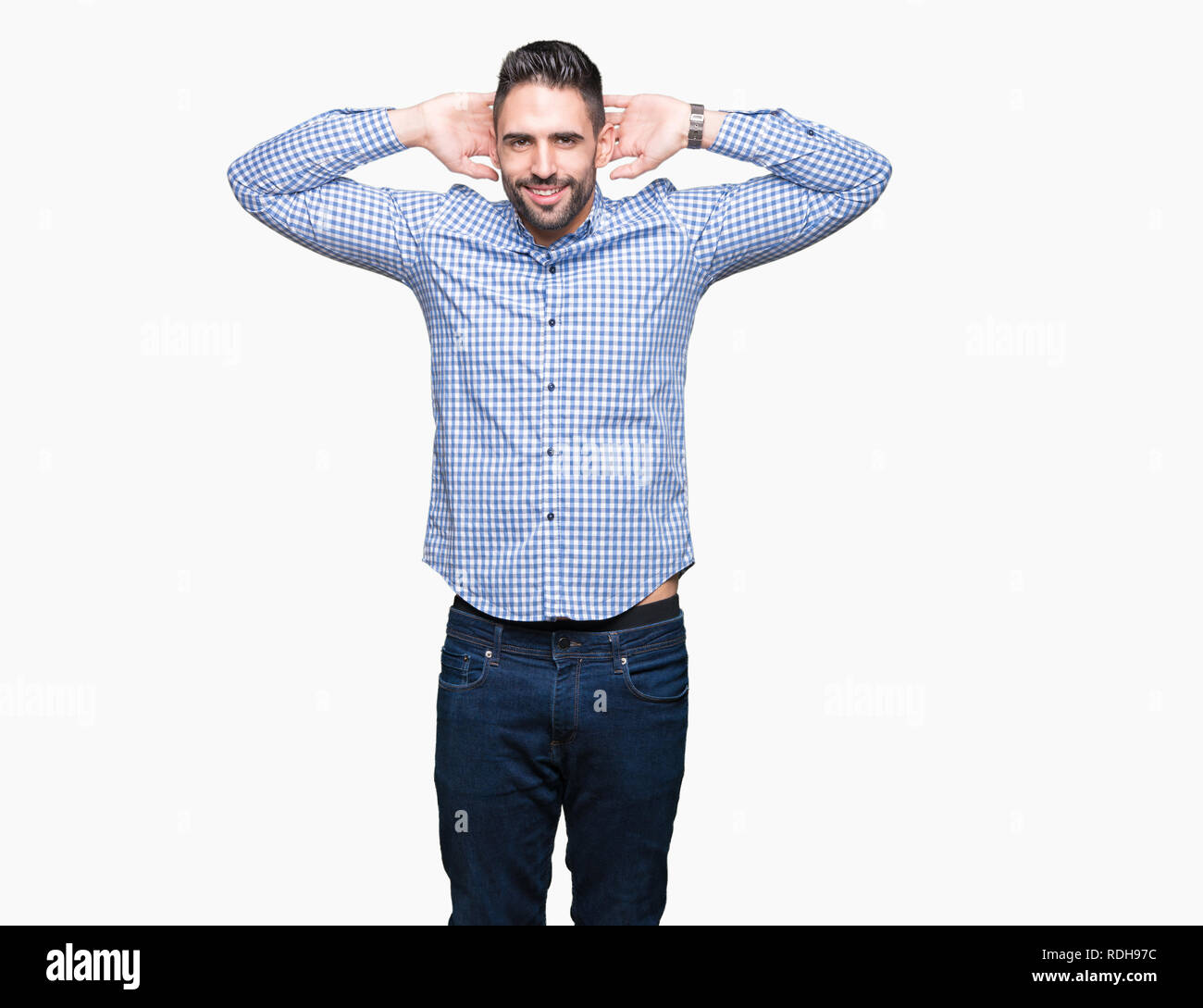 Young handsome man over isolated background Relaxing and stretching ...