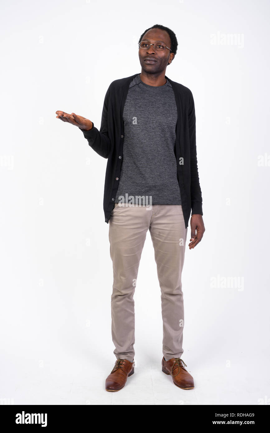 Full body shot of African man talking with hand raised Stock Photo - Alamy