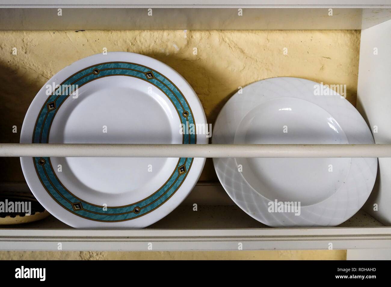 Crockery plate rack and shelf mounted on kitchen wall Stock Photo - Alamy