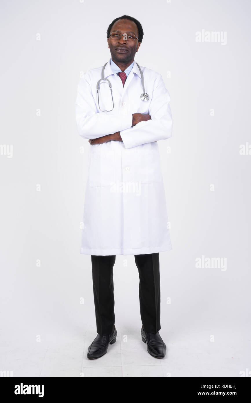 Full body shot of African man doctor with arms crossed Stock Photo - Alamy