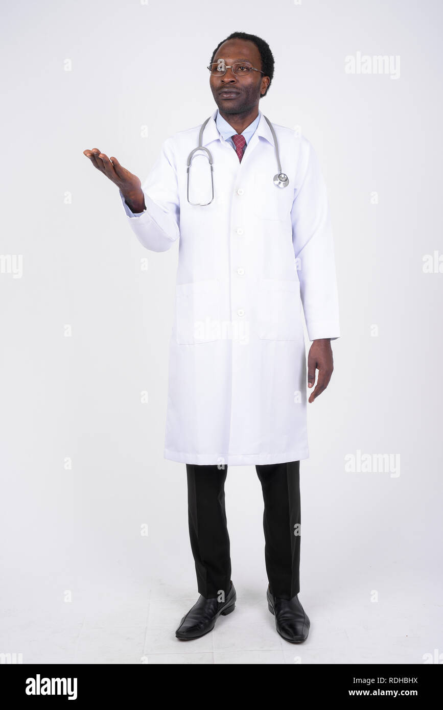 Full body shot of African man doctor explaining something Stock Photo ...