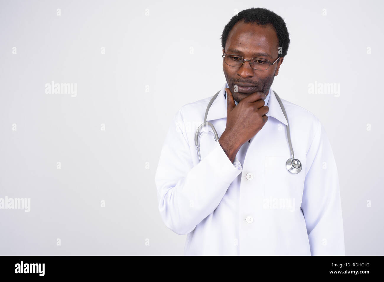 Serious thoughtful african male doctor hi-res stock photography and ...