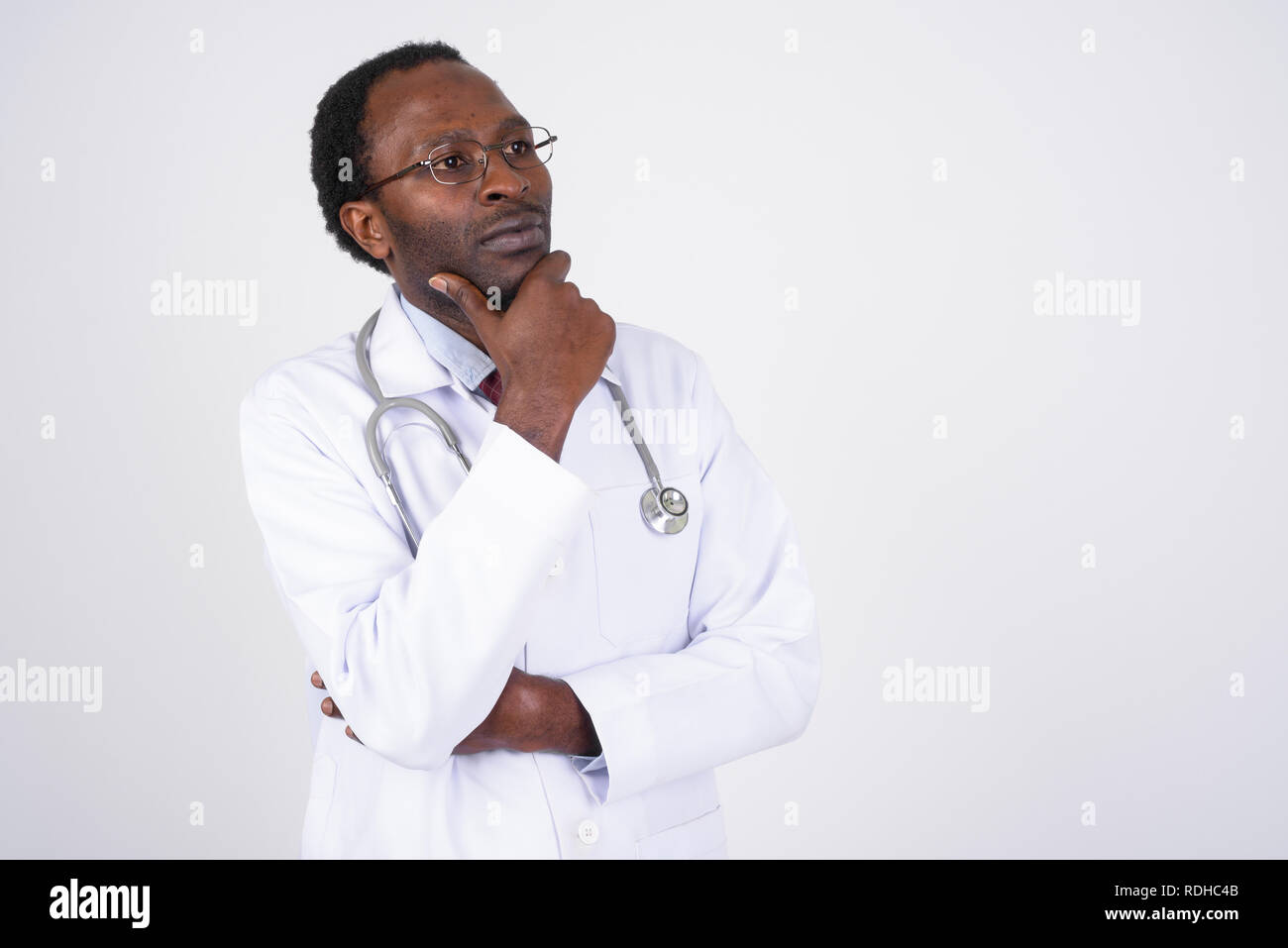 Portrait of African man doctor with eyeglasses thinking Stock Photo - Alamy