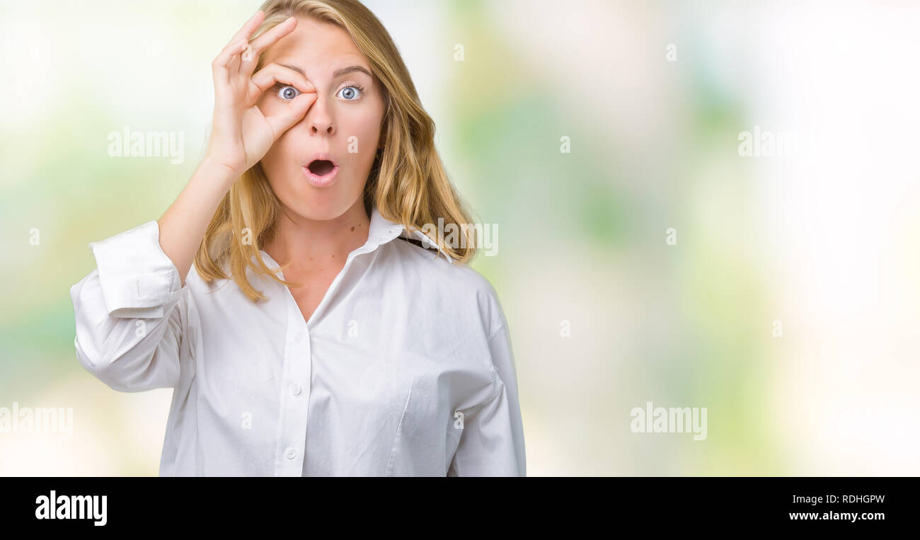 Beautiful young business woman over isolated background doing ok ...