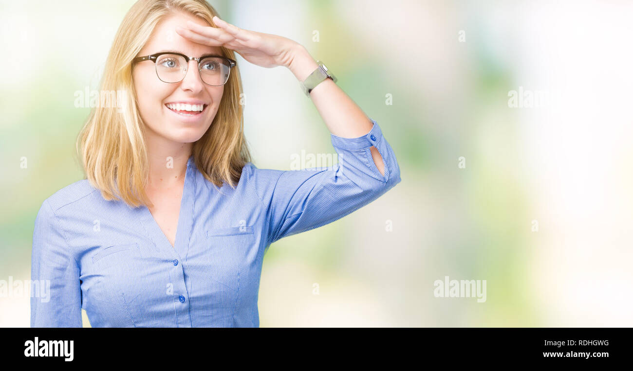 Beautiful young business woman over isolated background very happy and ...