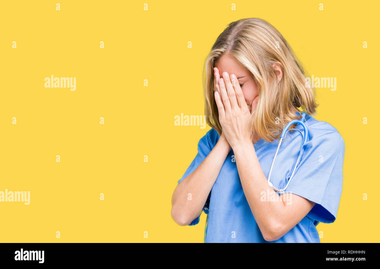 Beautiful young doctor woman wearing medical uniform over isolated ...