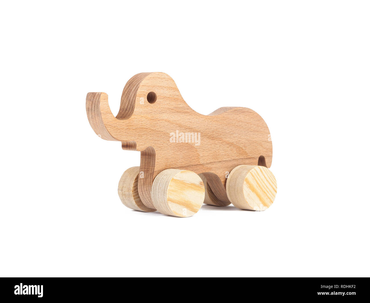 Photo of a wooden elephant on wheels of beech. Toy made of wood ...
