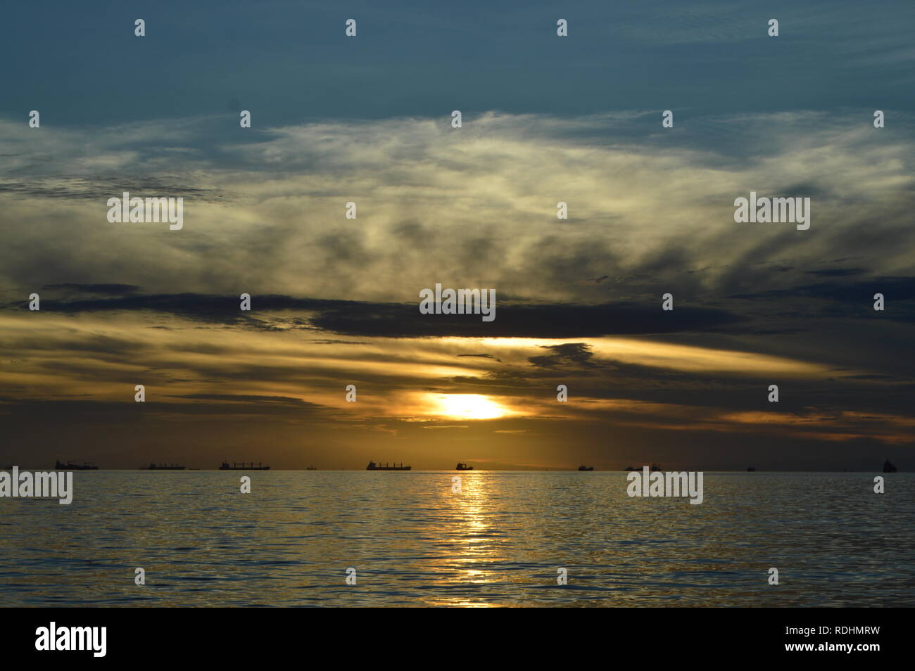 Beautiful sunset in the harbor of the Port of Manila Philippines Stock ...