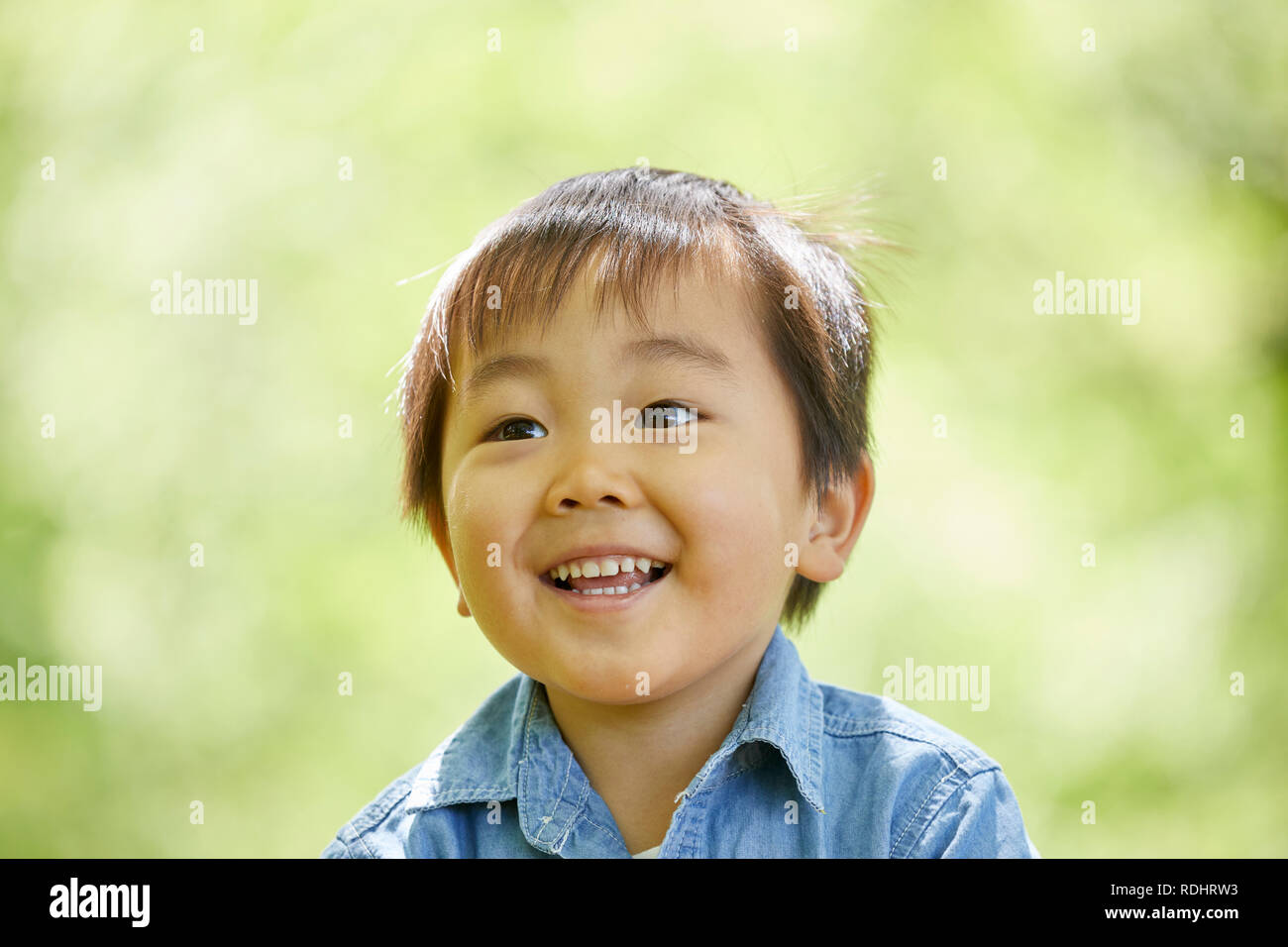 Japanese kid in a city park Stock Photo - Alamy