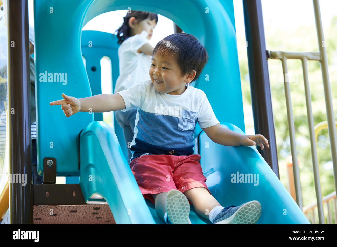 Two asian kids in playground hi-res stock photography and images - Alamy