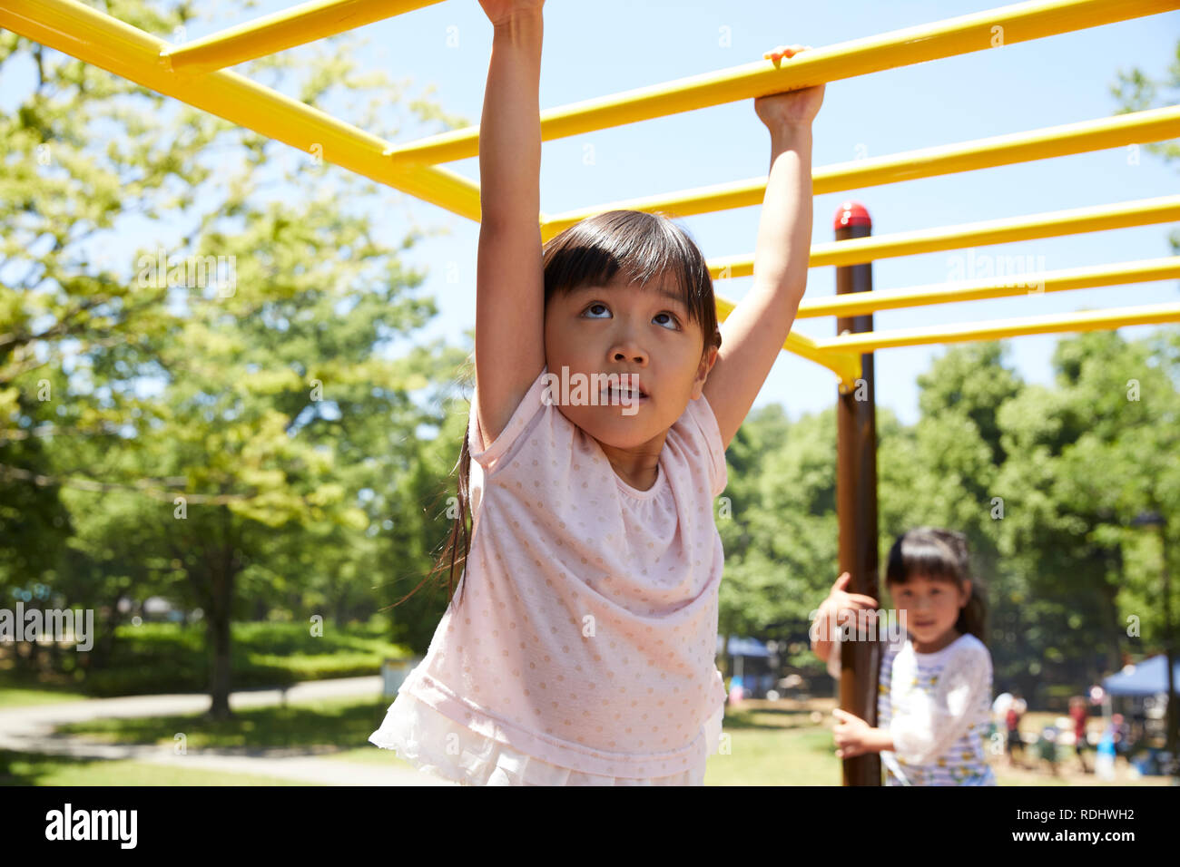 Two asian kids in playground hi-res stock photography and images - Alamy