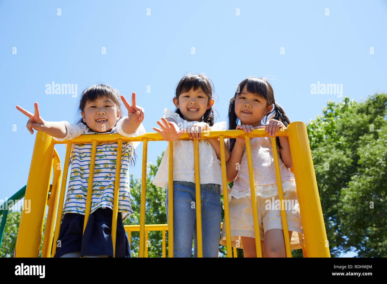 Three people playground japanese child children hi-res stock ...