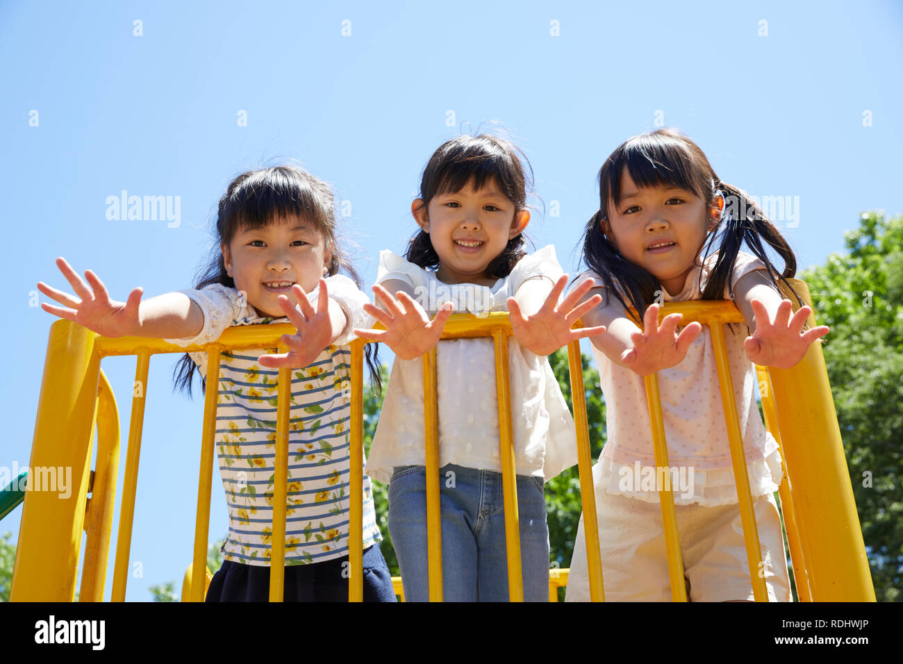 Three people playground japanese child children hi-res stock ...