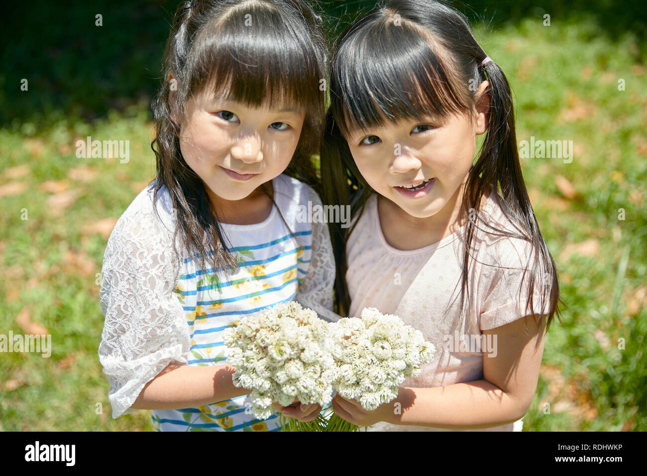 Two asian kids in playground hi-res stock photography and images - Alamy