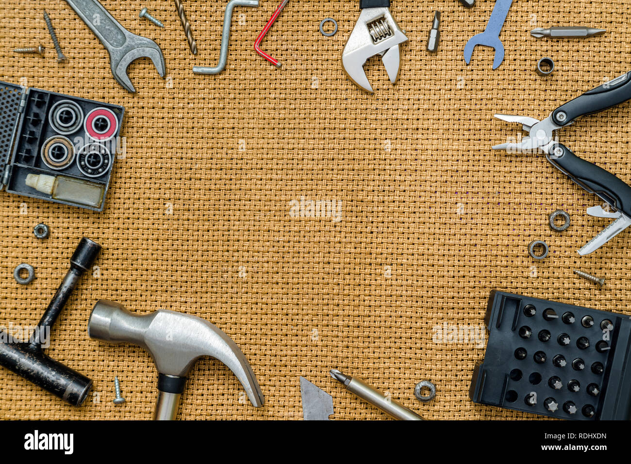 repairing tools still life on brown background with space for type ...