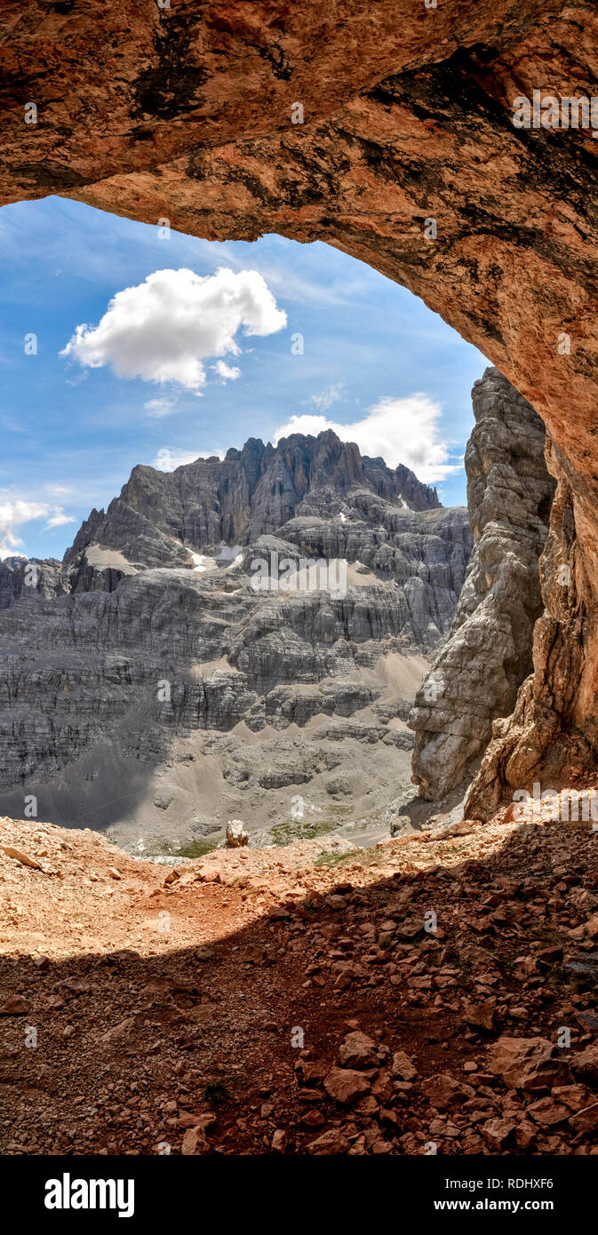 View from cave in Italian Dolomites with their typical rocky peaks ...